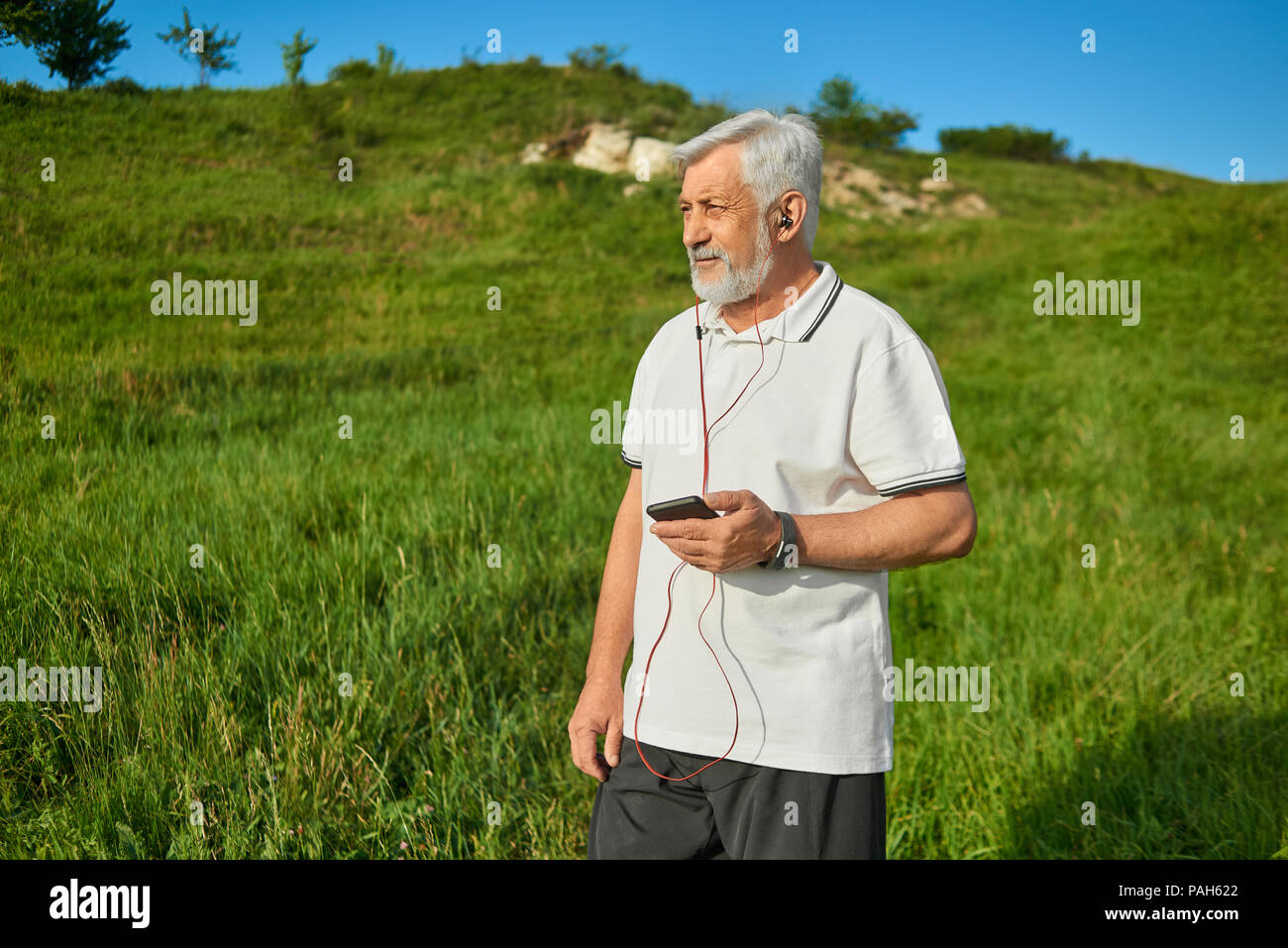 Male watching smartphone headphones hi-res stock photography and images ...