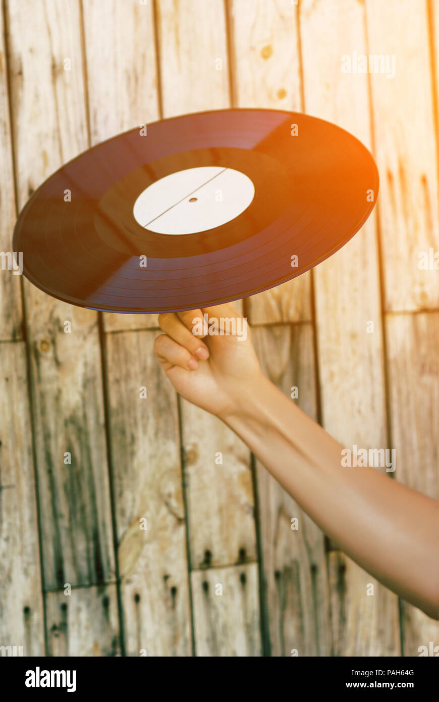Female holding vinyl plate hi-res stock photography and images - Alamy