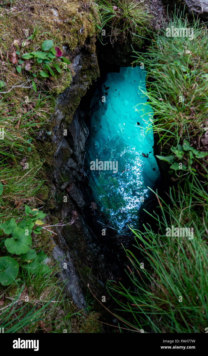 crazy blue water cave floatet with light blue watter, swiss alps Stock ...