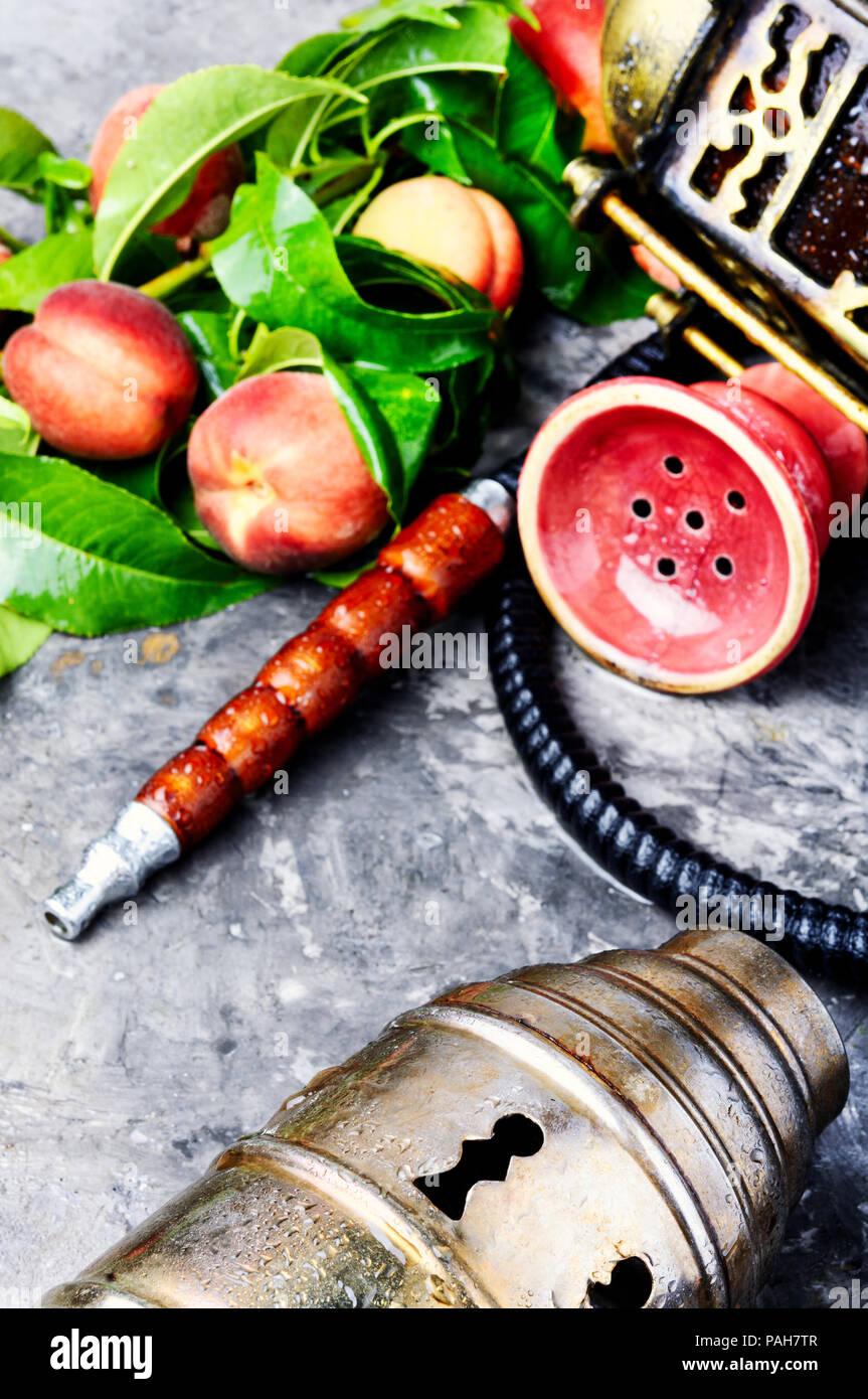Hookah for smoking with the aroma peach.Peach shisha Stock Photo - Alamy
