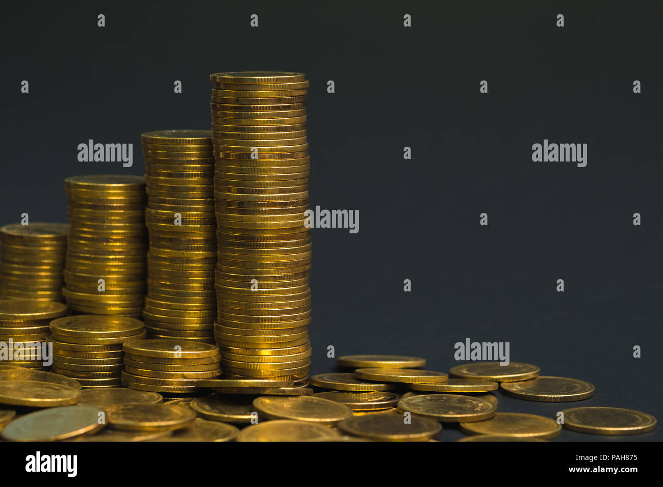 Savings, increasing columns of coins, piles of coins arranged as a ...