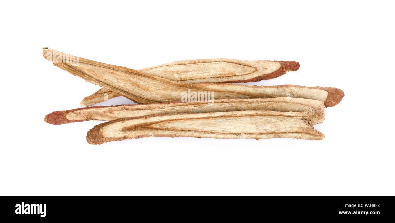 dried Liquorice roots on a white background Stock Photo - Alamy