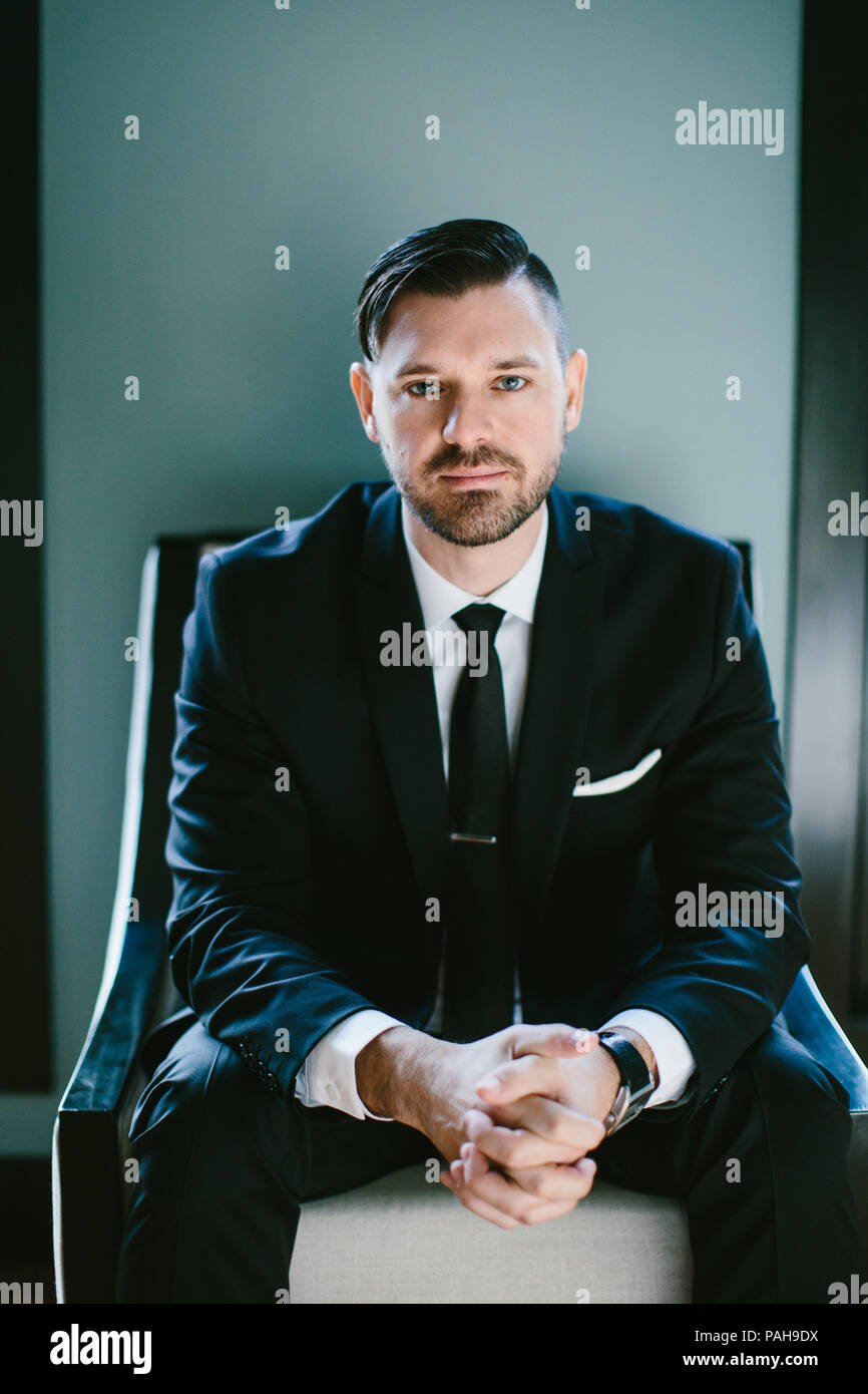 professional man sitting and making eye contact Stock Photo - Alamy