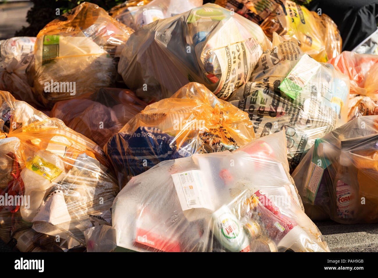 Recycling plastic waste sacks in a pile awaiting collection hi-res ...