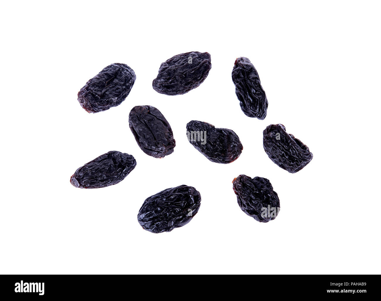 black raisin is a dried grape isolated on white background Stock Photo ...