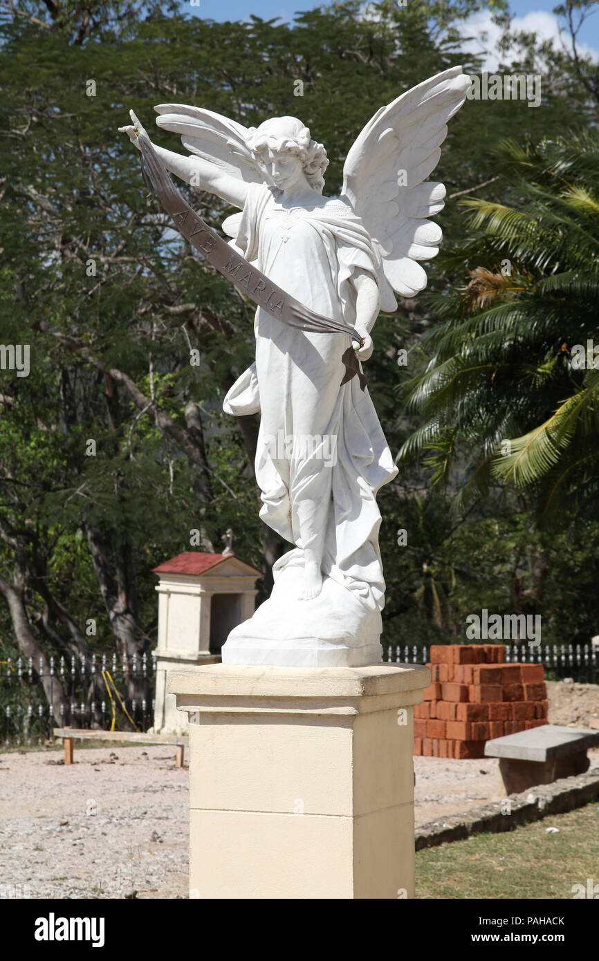 Cuba - angel statue in front of famous basilica of El Cobre. Year 2012 ...