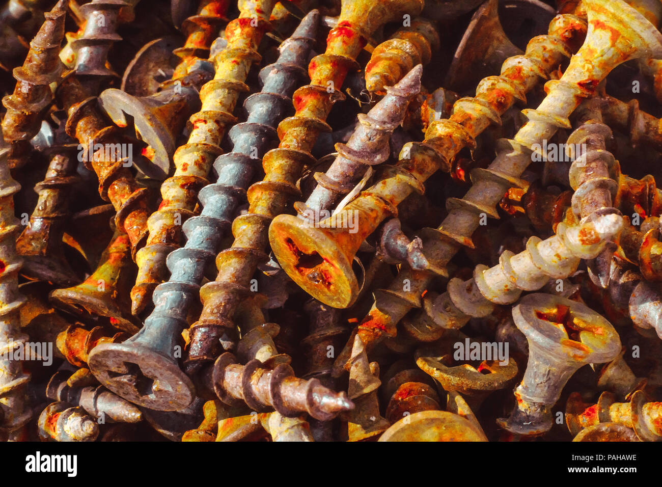 Pile of old rusty screw heads, bolts, metal nuts, isolated Stock Photo ...