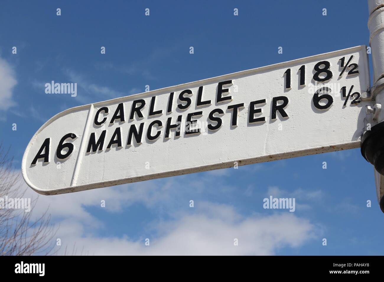 Road sign in England: A6 road to Carlisle and Manchester. Distances in ...