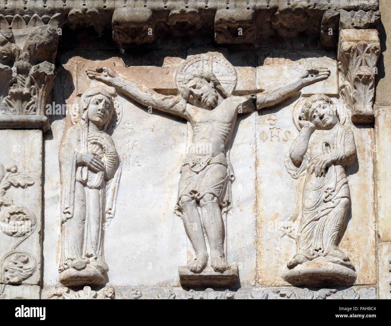 Crucifixion, medieval relief on the facade of Basilica of San Zeno in ...