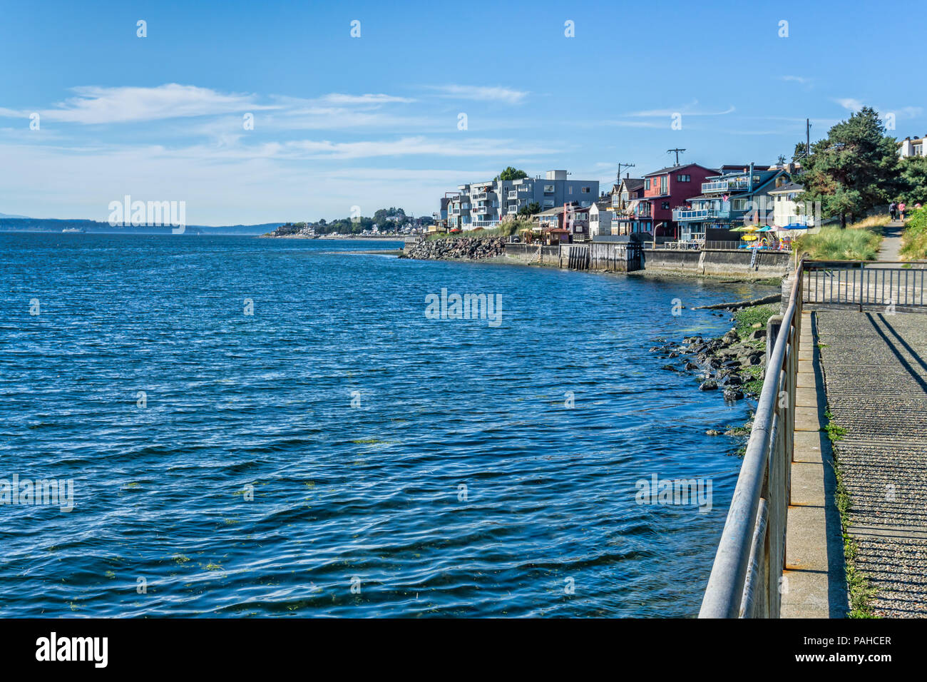 A view of the shoreline in West Seattle, Washington. The tide is in ...