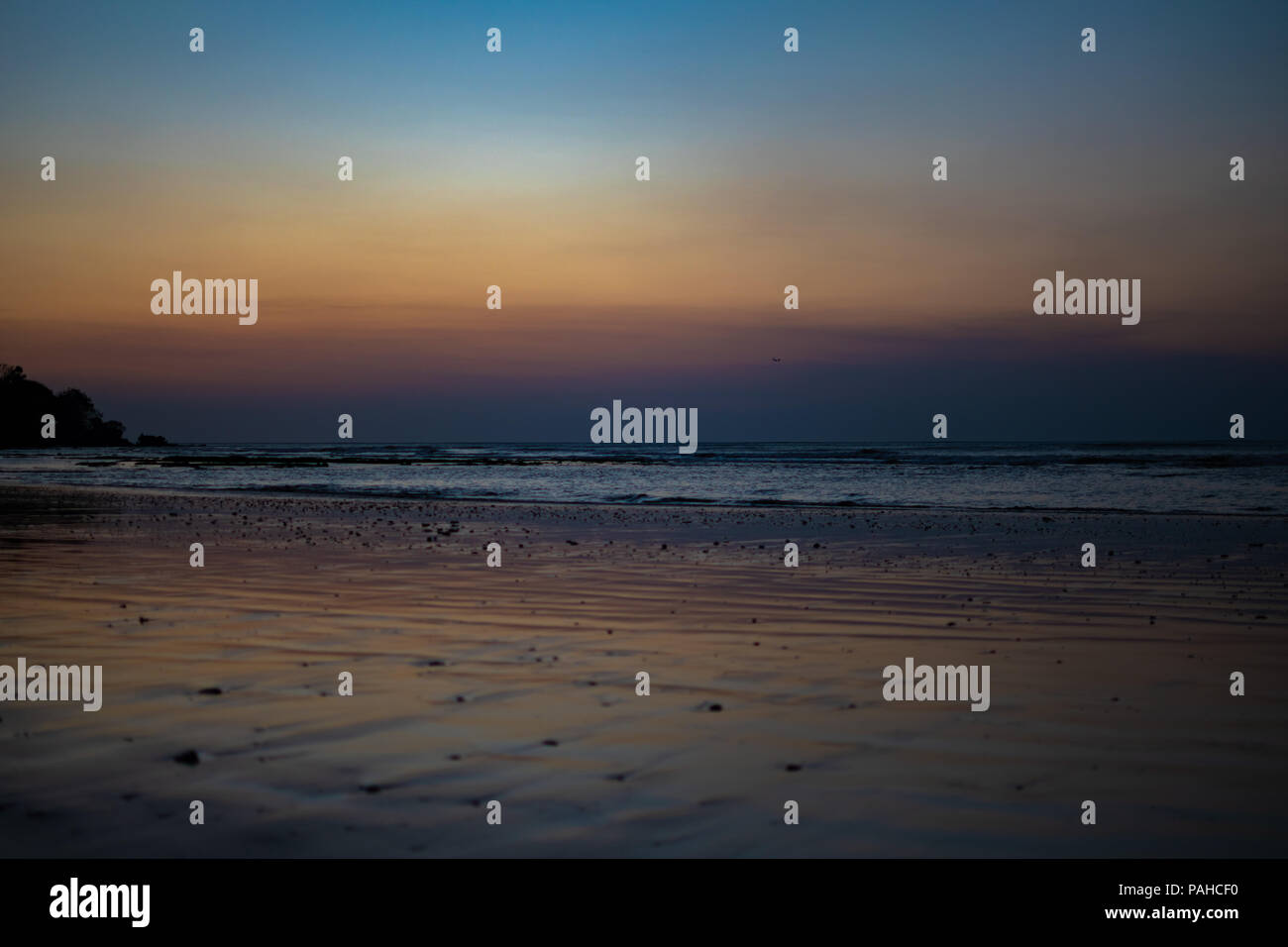 beautiful sunset on the beach of the Jimbaran village . Bali, Indonesia ...