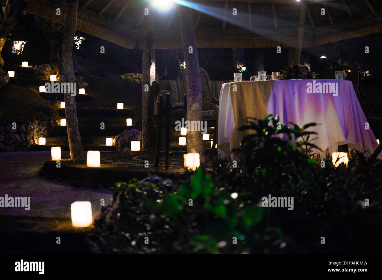 Romantic candlelight dinner table with lamp Stock Photo - Alamy
