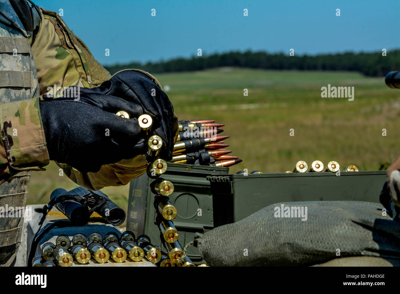 A U.S. Army Reserve Soldier prepares ammunition for qualification fire ...