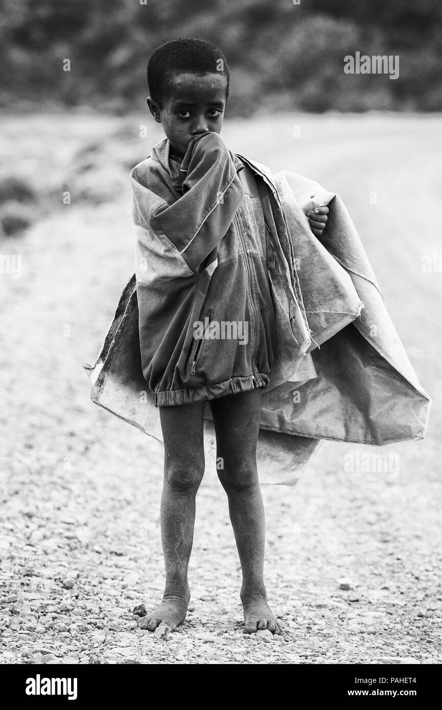 AKSUM, ETHIOPIA - SEPTEMBER 22, 2011: Unidentified Ethiopian boy walks ...