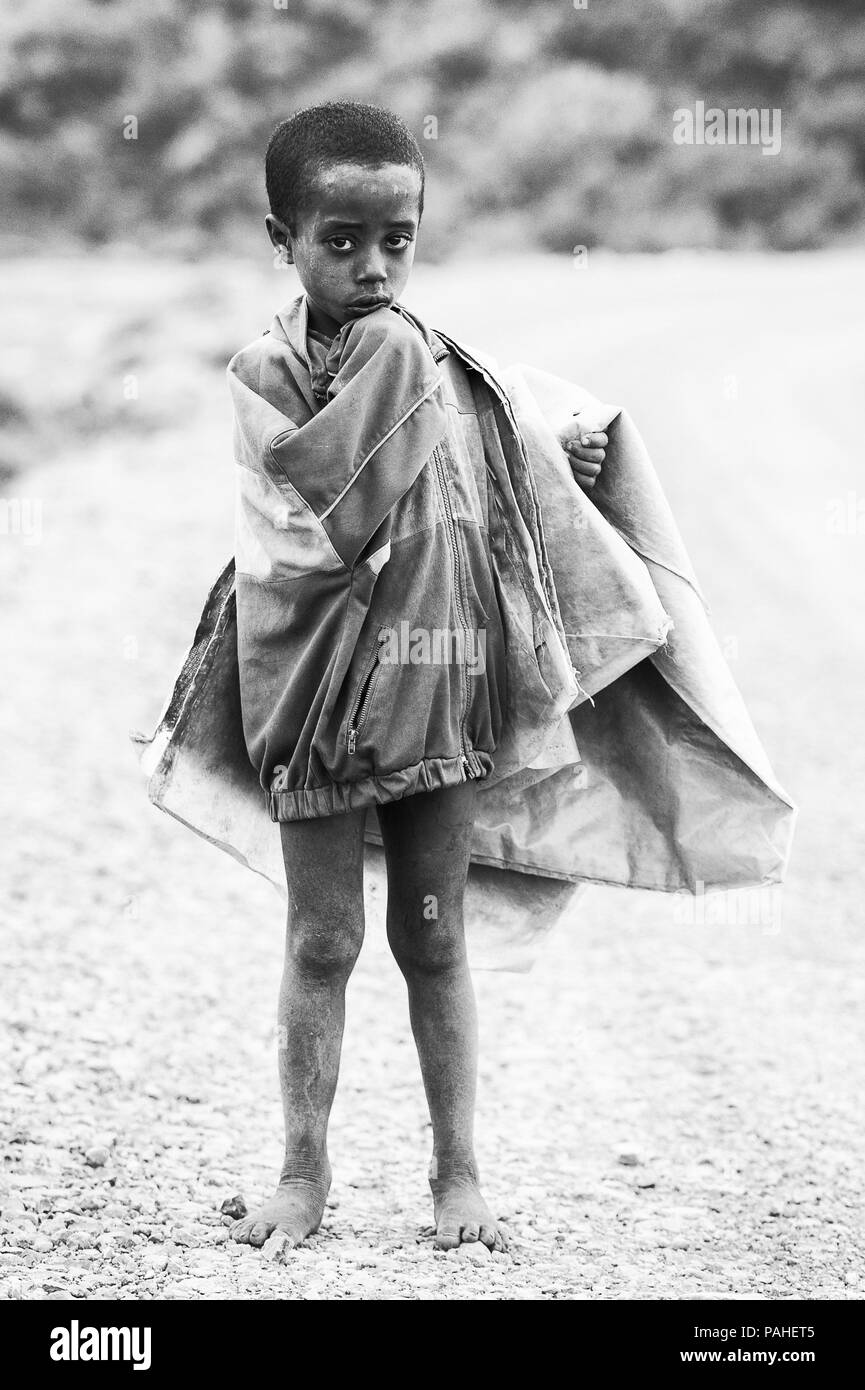 AKSUM, ETHIOPIA - SEPTEMBER 22, 2011: Unidentified Ethiopian boy walks ...