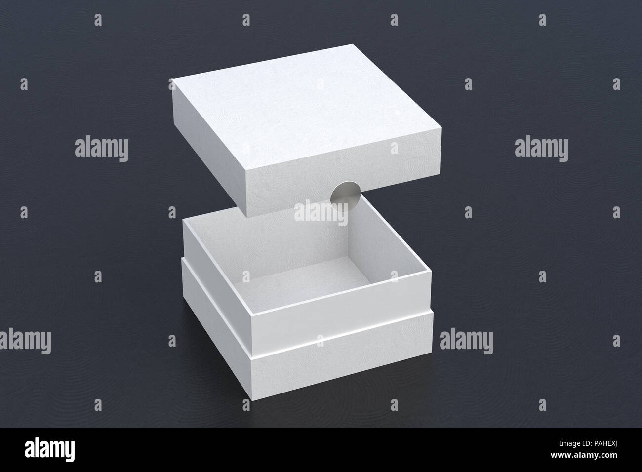 Opened white empty square box with cover flying above box on dark ...
