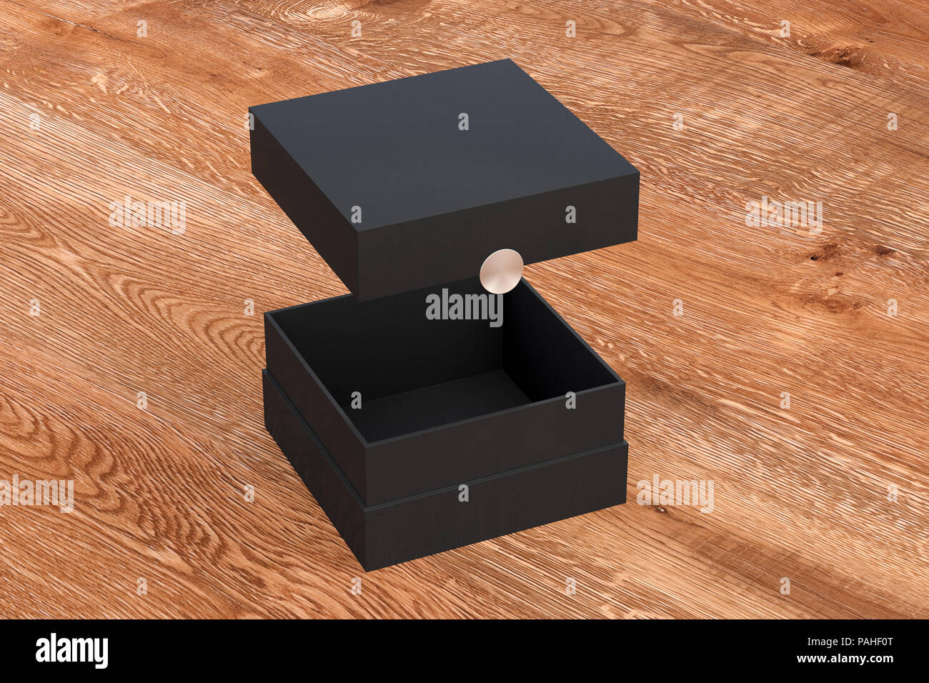 Opened black empty square box with cover flying above box on wooden ...