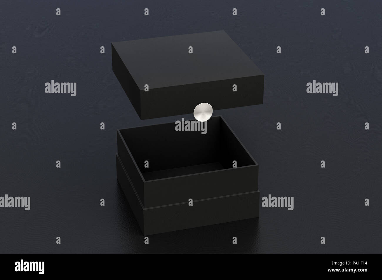 Opened black empty square box with cover flying above box on dark ...