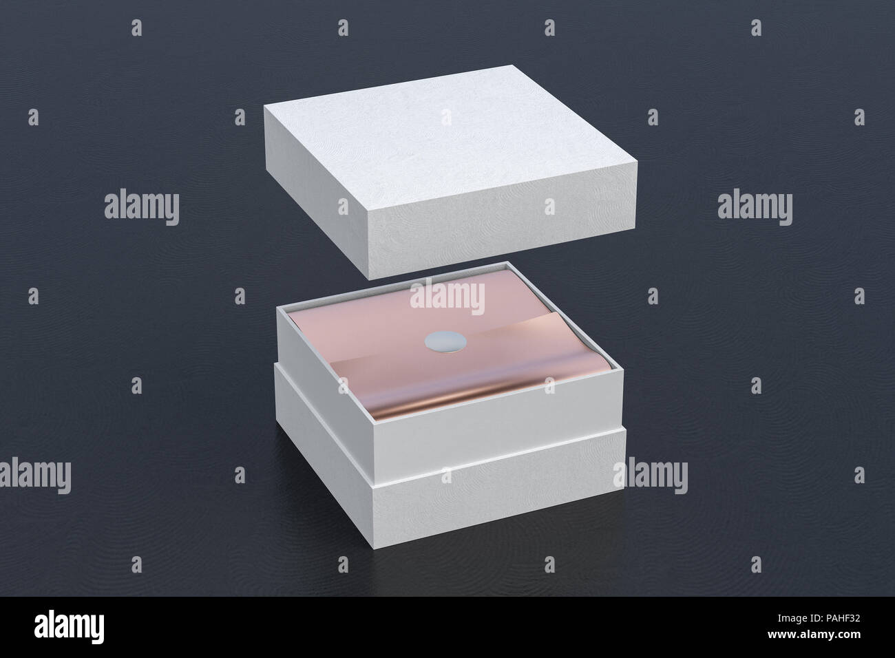 Opened white square box with copper wrapping paper inside box and cover ...