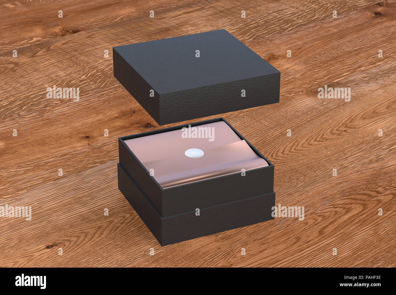 Opened black square box with copper wrapping paper inside box and cover ...