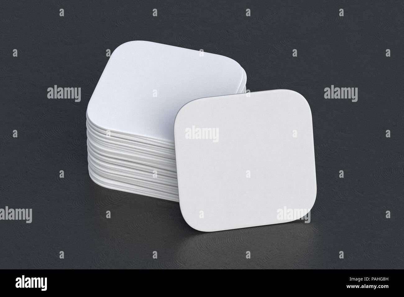 White square beer coasters on black background with clipping path ...