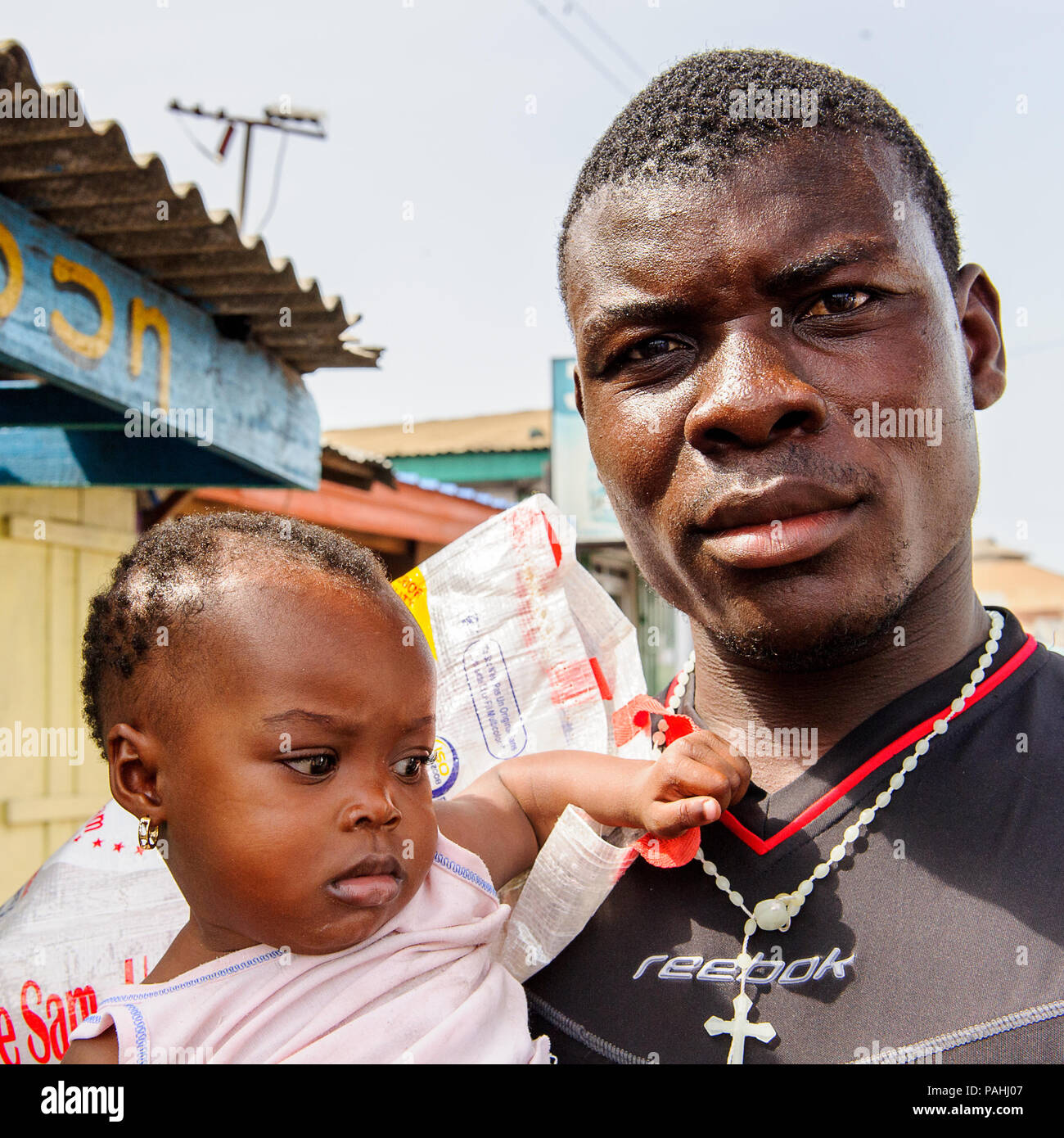 GHANA - MARCH 2, 2012: Unindentified Ghanaian father and his baby in ...