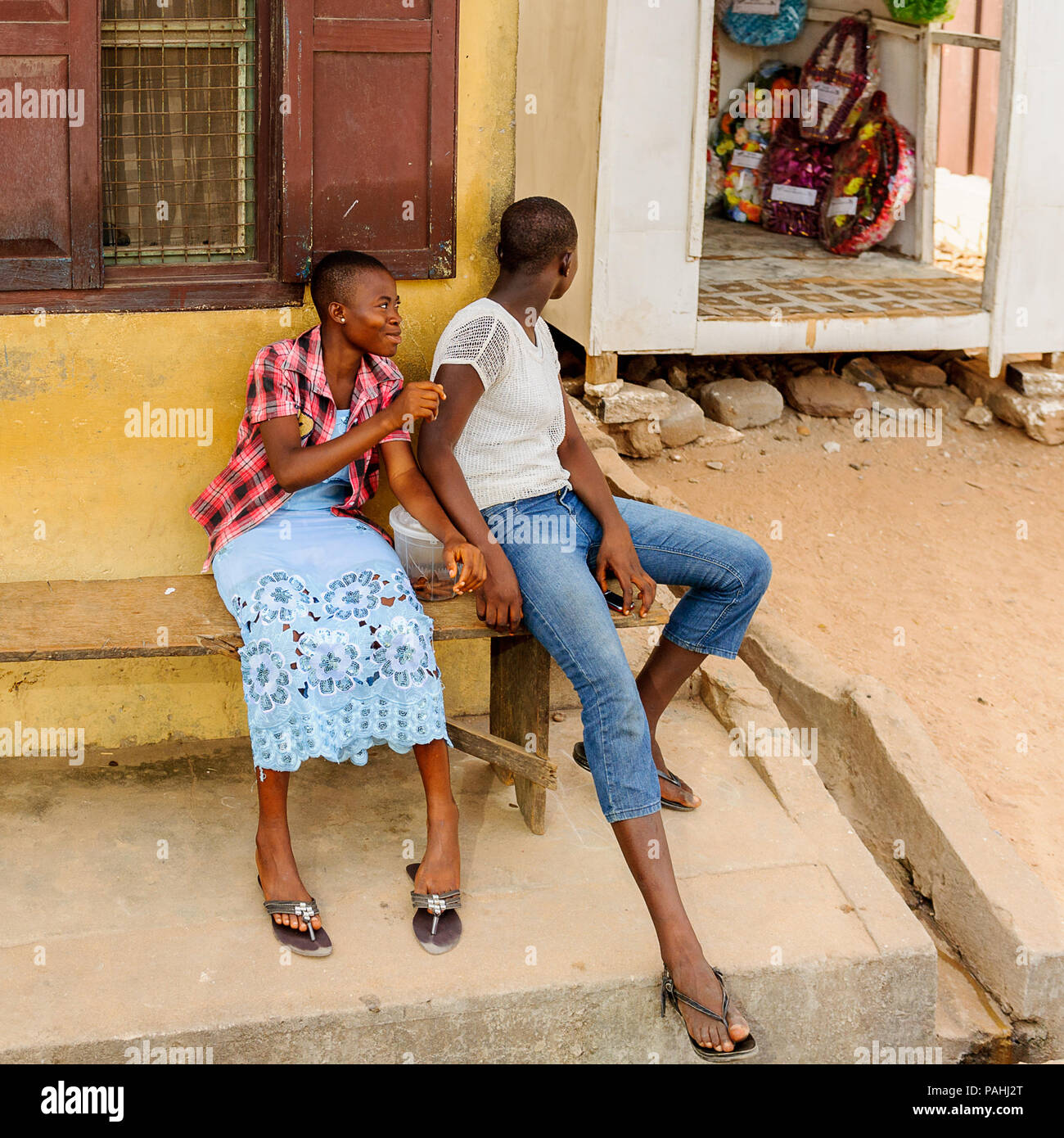 ACCRA, GHANA - MARCH 2, 2012: Unidentified Ghanaian two women are shy ...