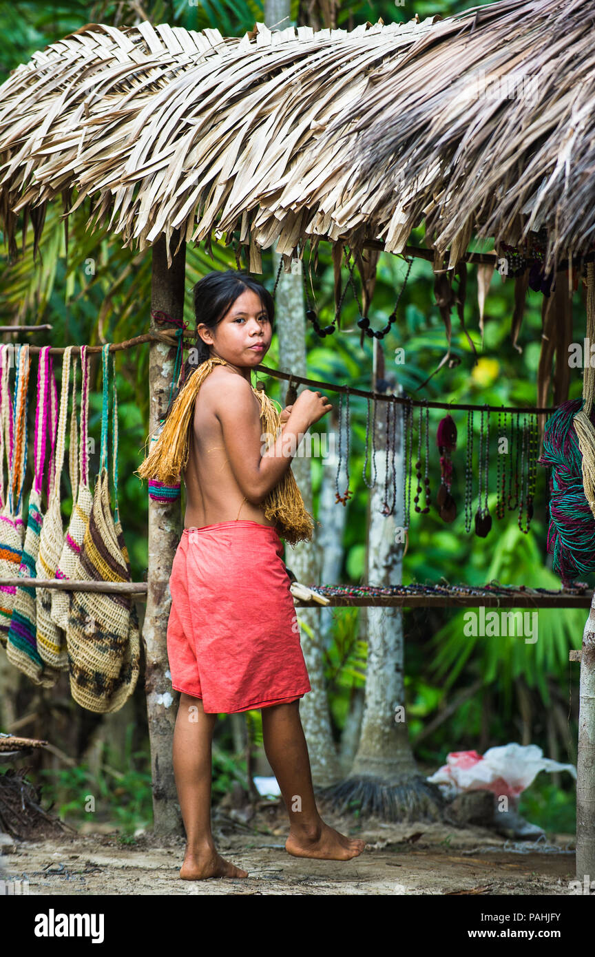 AMAZONIA, PERU - NOV 10, 2010: Unidentified Amazonian girl sells beads ...