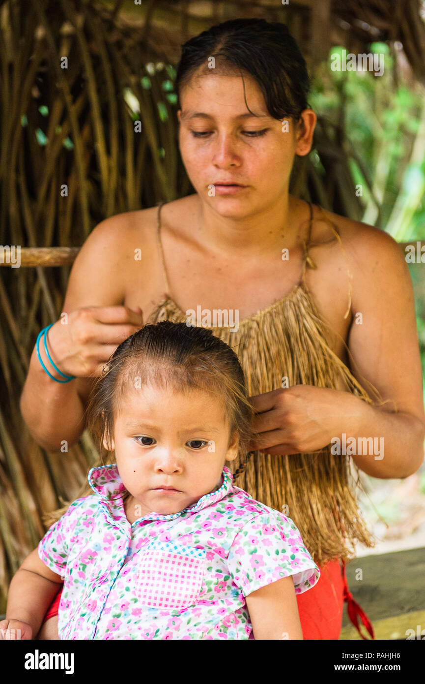 AMAZONIA, PERU - NOV 10, 2010: Unidentified Amazonian indigenous woman ...
