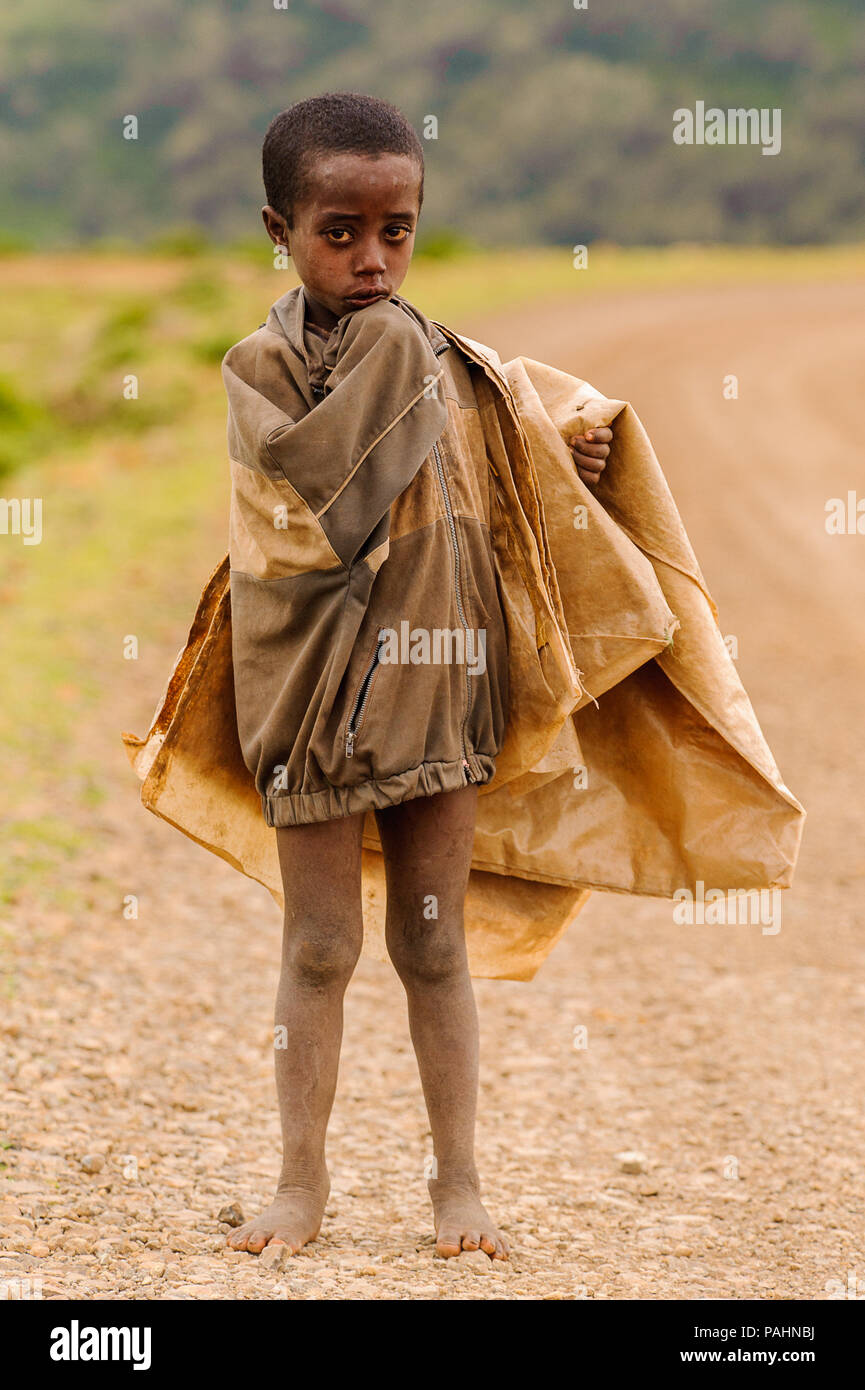 AKSUM, ETHIOPIA - SEPTEMBER 22, 2011: Unidentified Ethiopian boy walks ...
