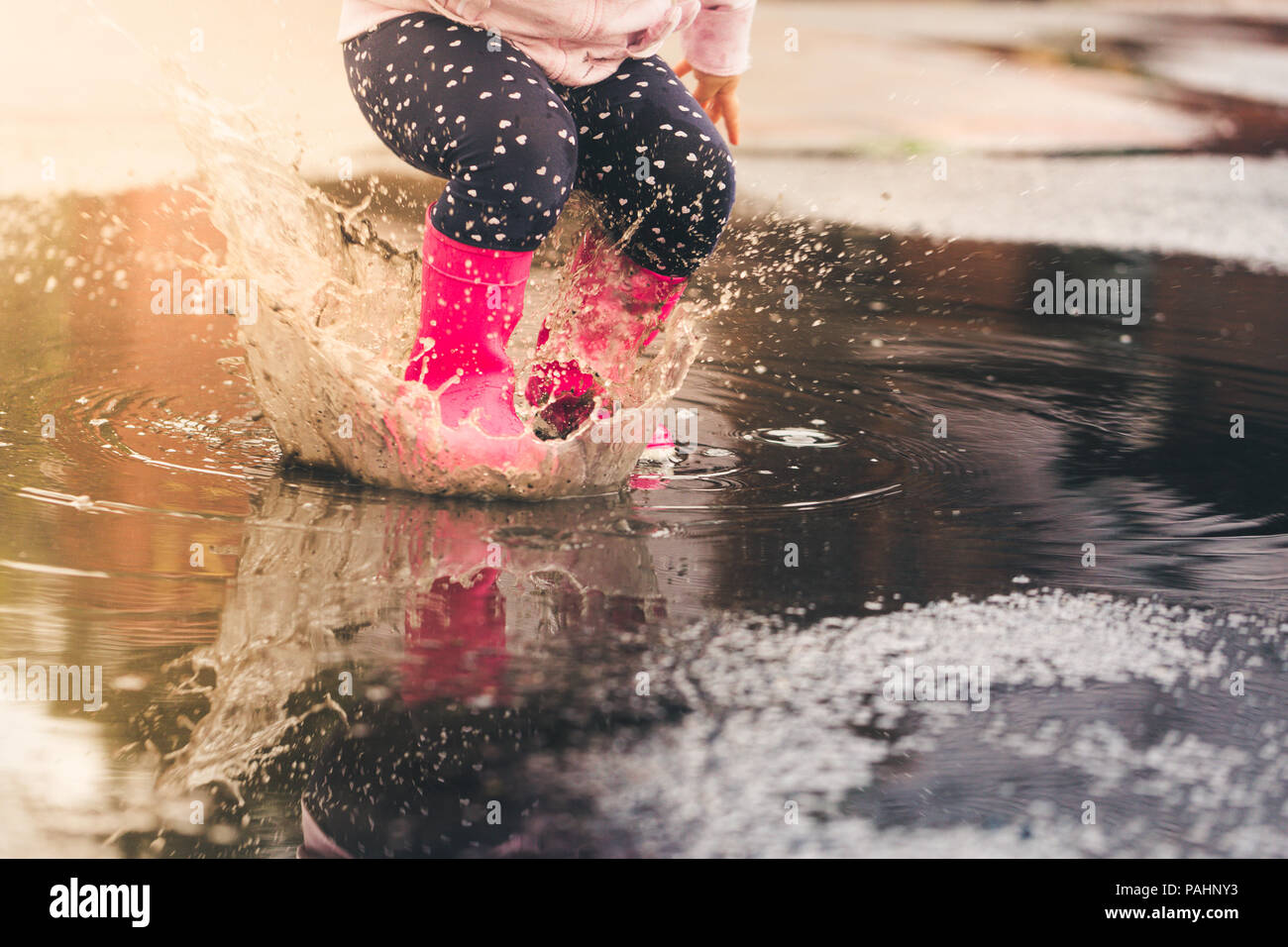 Child puddle splash hi-res stock photography and images - Alamy
