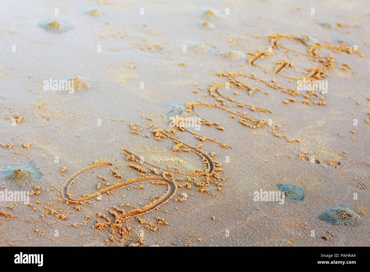 Wording of summer on sand beach with texture Stock Photo - Alamy