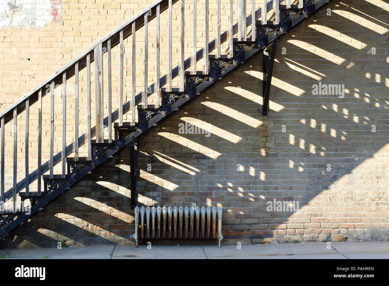 An old radiator is the focus of this image featuring an urban fire ...