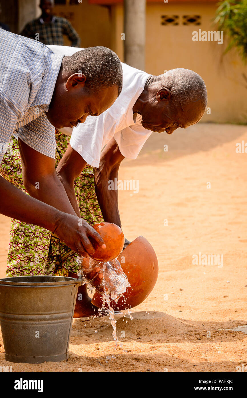 LOME, TOGO - MAR 9, 2013: Unidentified Togolese men in traditional ...