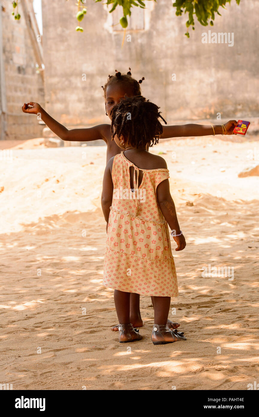 KARA, TOGO - MAR 10, 2013: Unidentified Togolese little girls run and ...