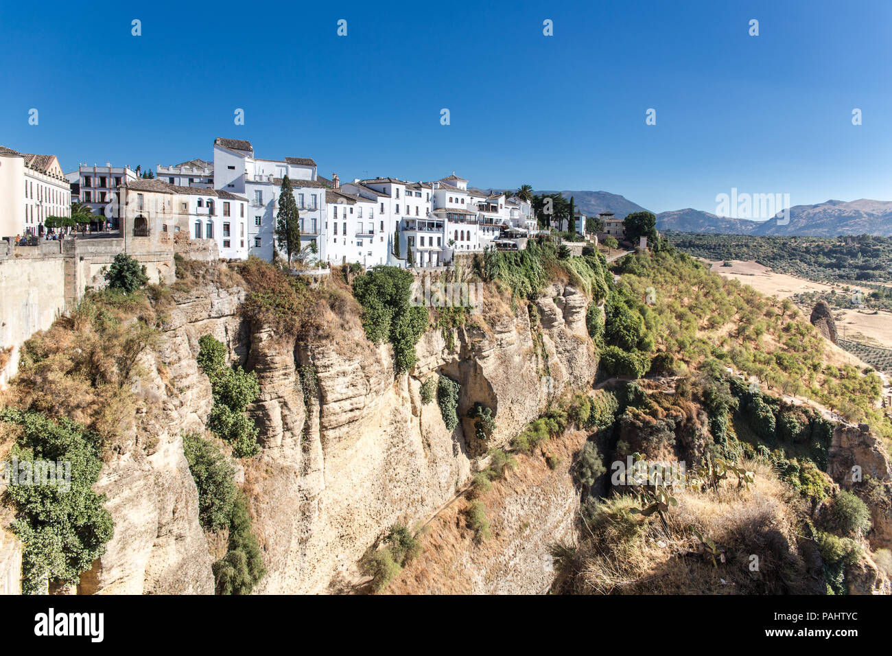 The famous stone bridge over the gorge of Tajo in Ronda, Andalusia ...