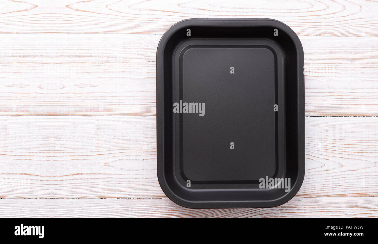 Empty baking tray for pizza close up on wooden background top view ...