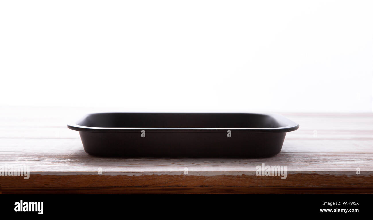 Empty baking tray for pizza close up on wooden background top view ...