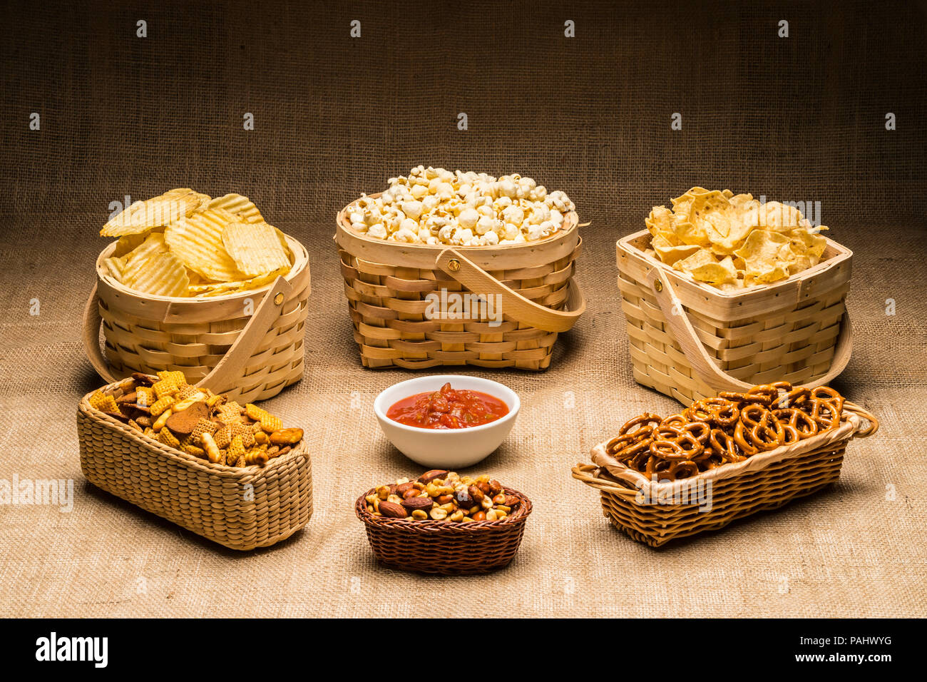 assorted party snacks in basket motif Stock Photo - Alamy