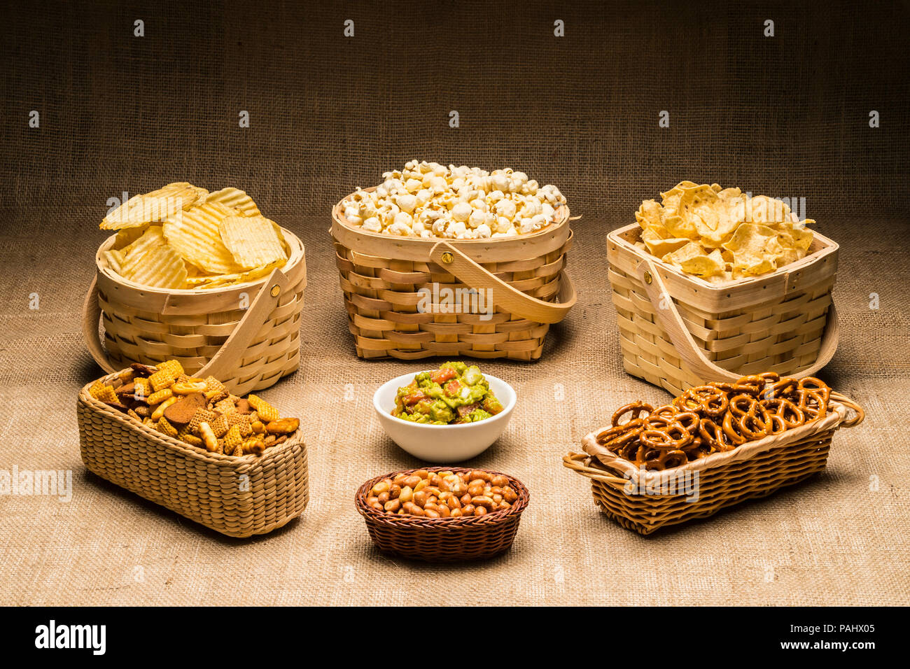 assorted party snacks in basket motif Stock Photo - Alamy