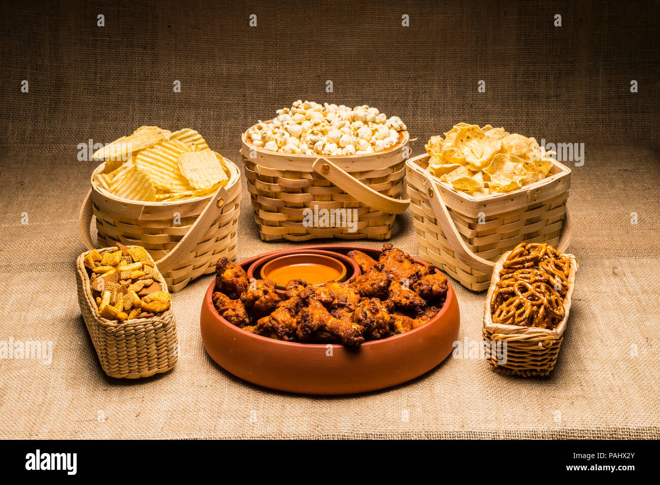 assorted party snacks in basket motif Stock Photo - Alamy