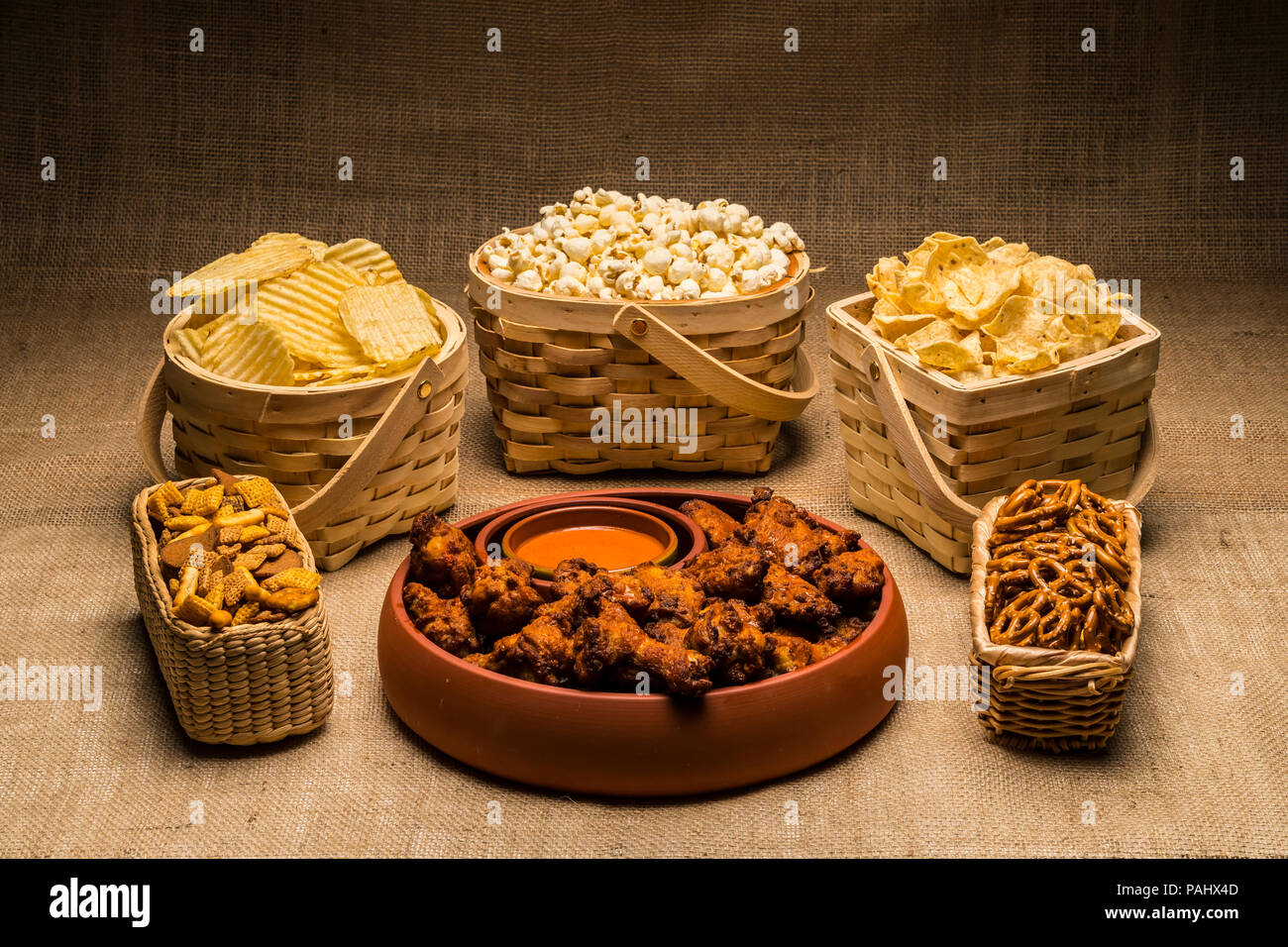 assorted party snacks in basket motif Stock Photo - Alamy
