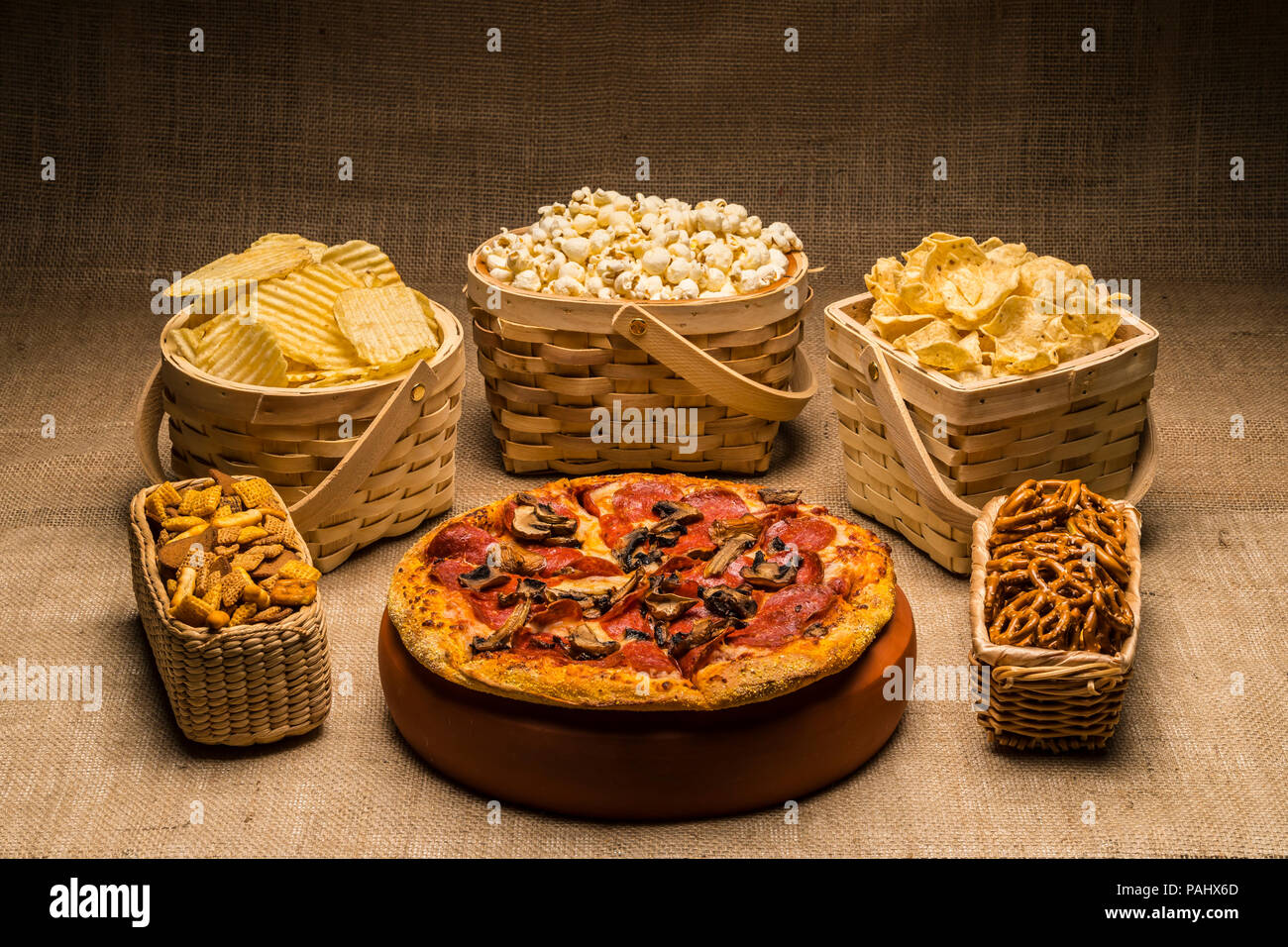 assorted party snacks in basket motif Stock Photo - Alamy