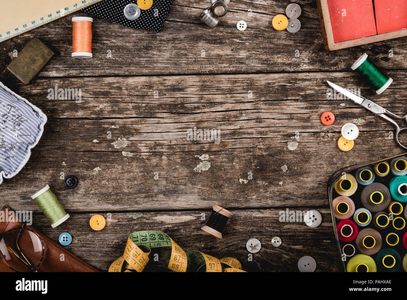 Beautiful set of scattered across rough wooden table metal scissors ...