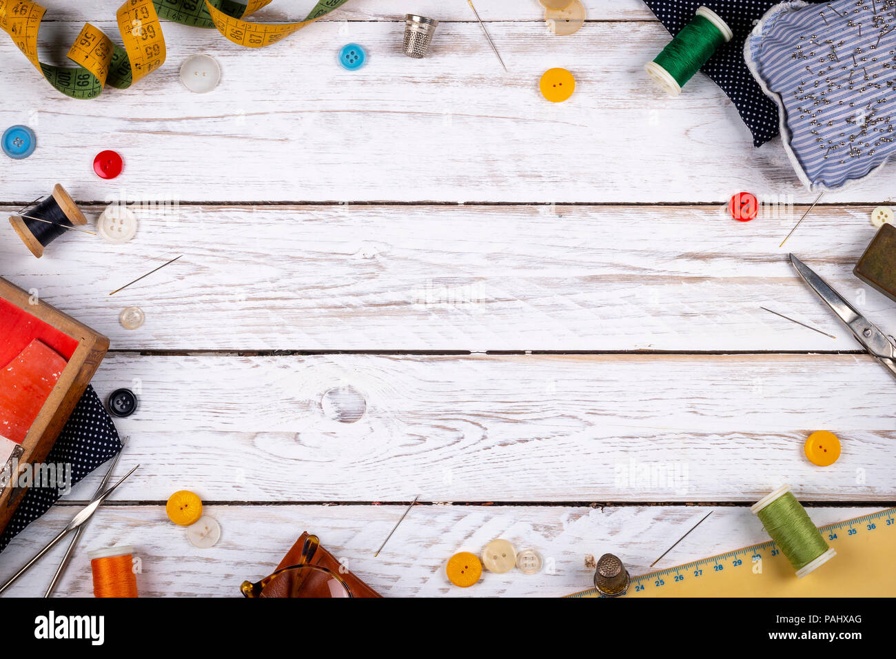 Beautiful set of scattered across white wooden table metal scissors ...