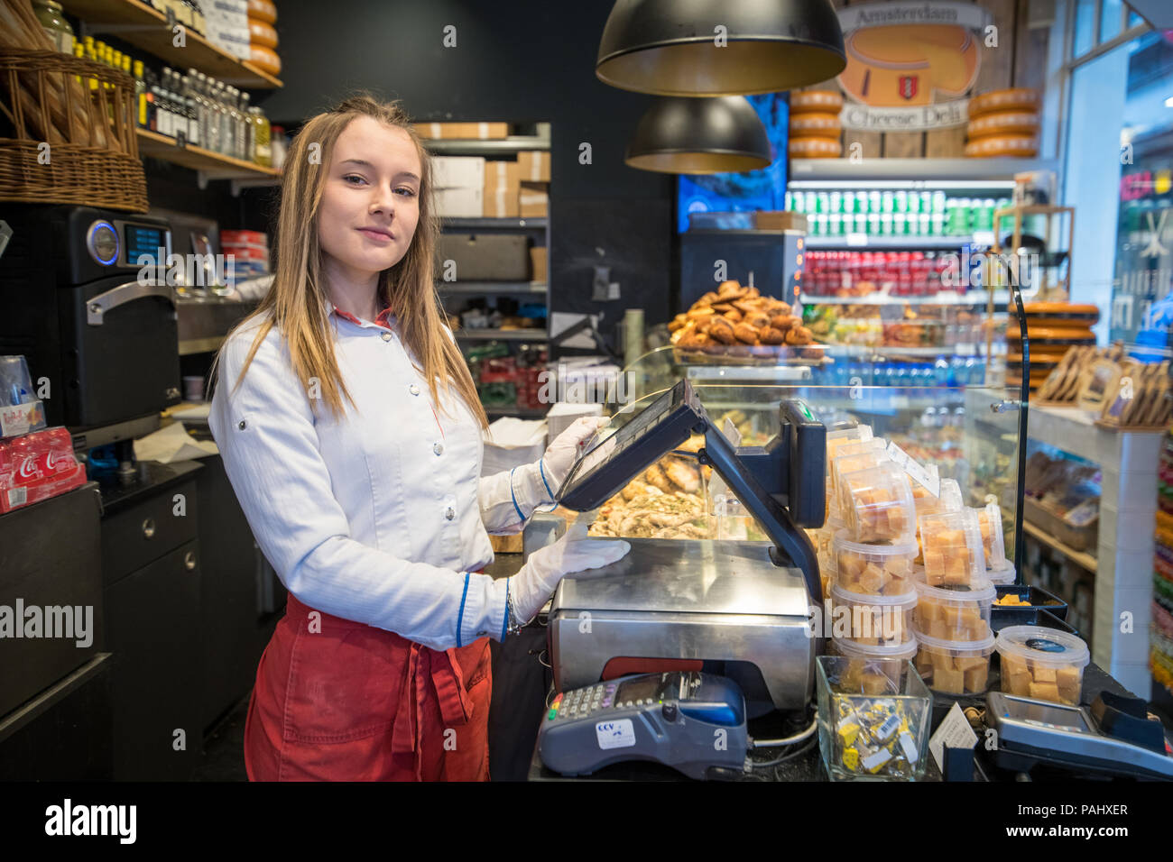 Female cashier hi-res stock photography and images - Alamy