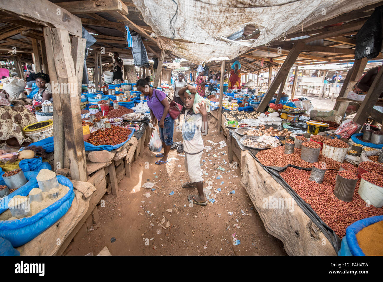 A boy and his mother shop in the market in Ganta, Liberia Stock Photo ...