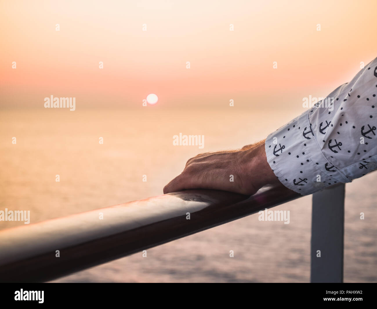 Men's hands on the railing Stock Photo - Alamy