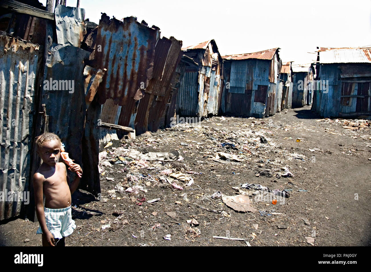 A little girl stands near her home in Cite Soleil, Haiti’s poorest and ...