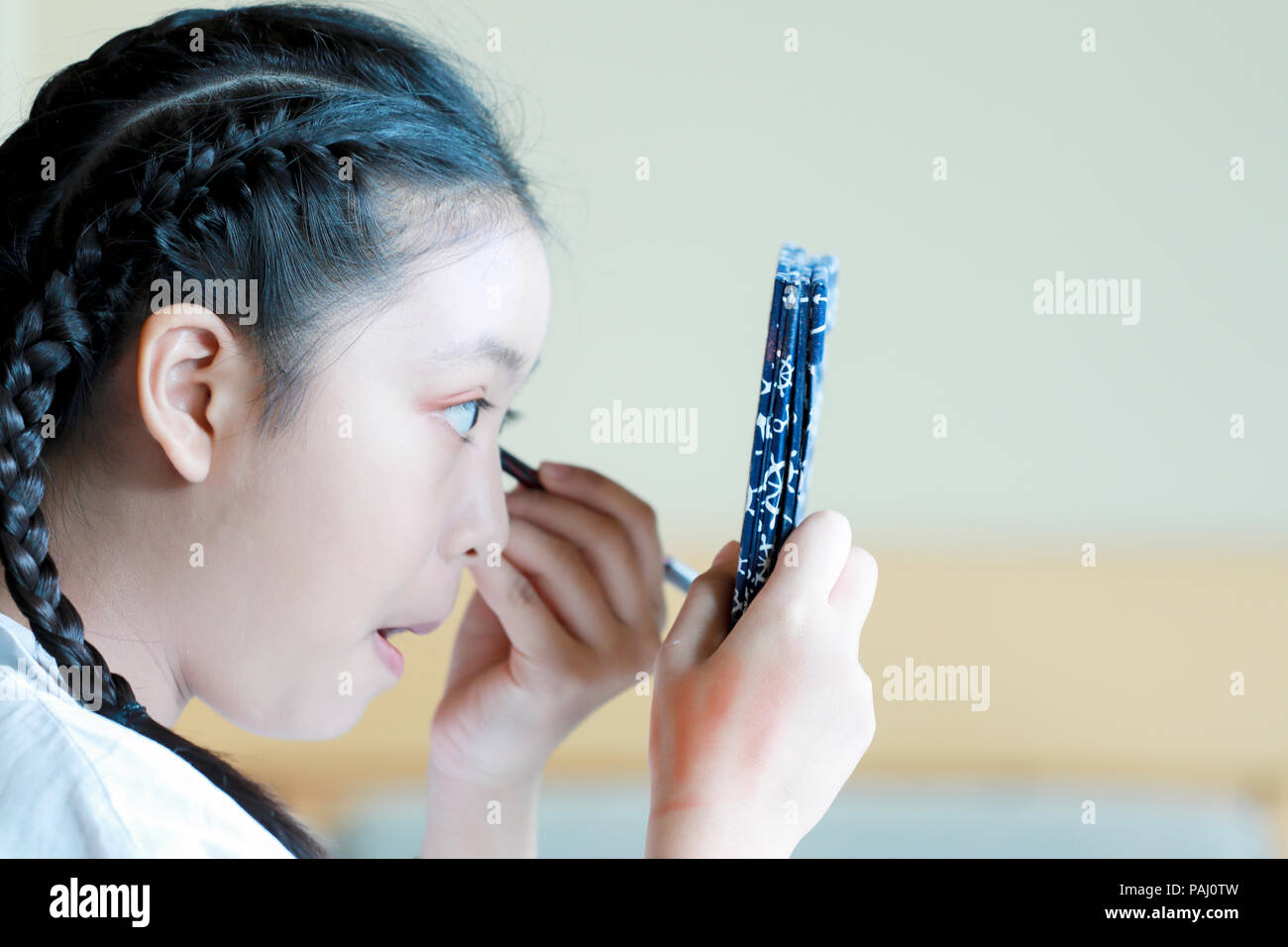 young cute girl makeup her face Stock Photo - Alamy